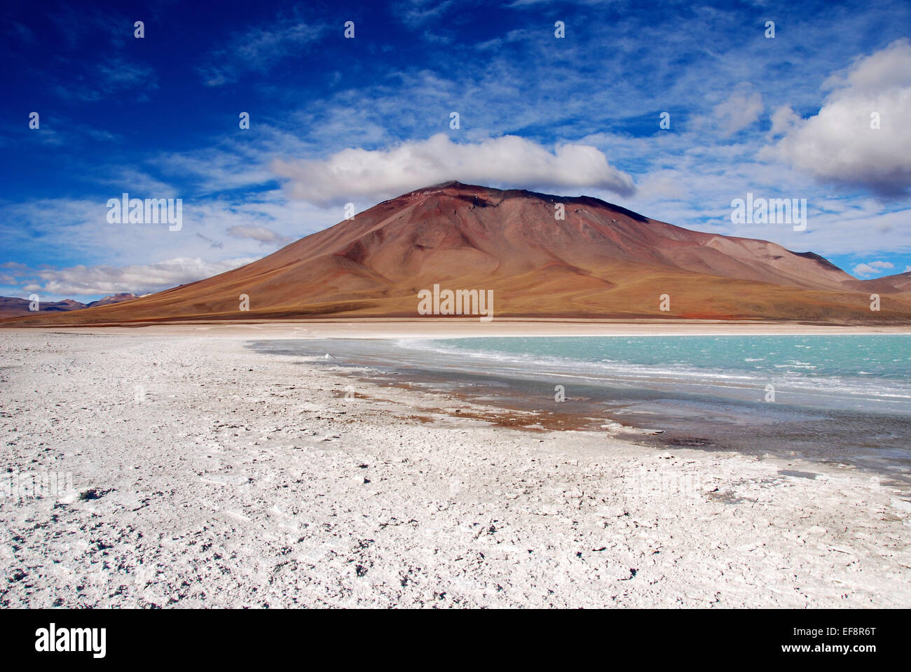 Bolivia, Altiplano, Volcano Licancabur seen from shore of Laguna Verde ...