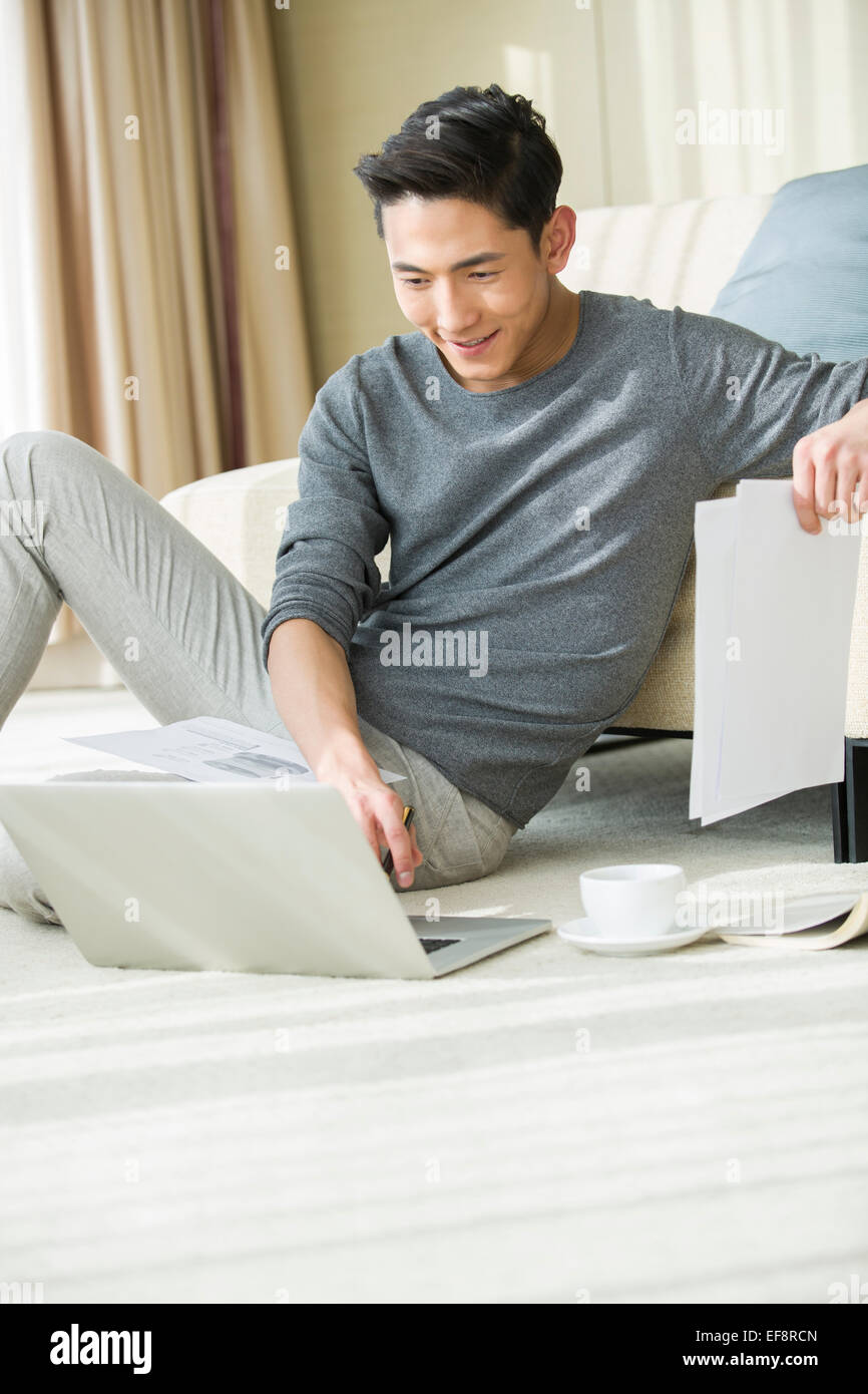 Young man working at home Stock Photo - Alamy