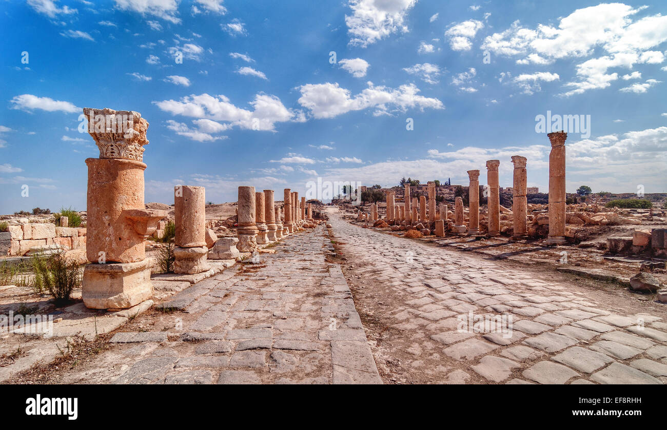 View along ancient roman road lined with columns hi-res stock ...
