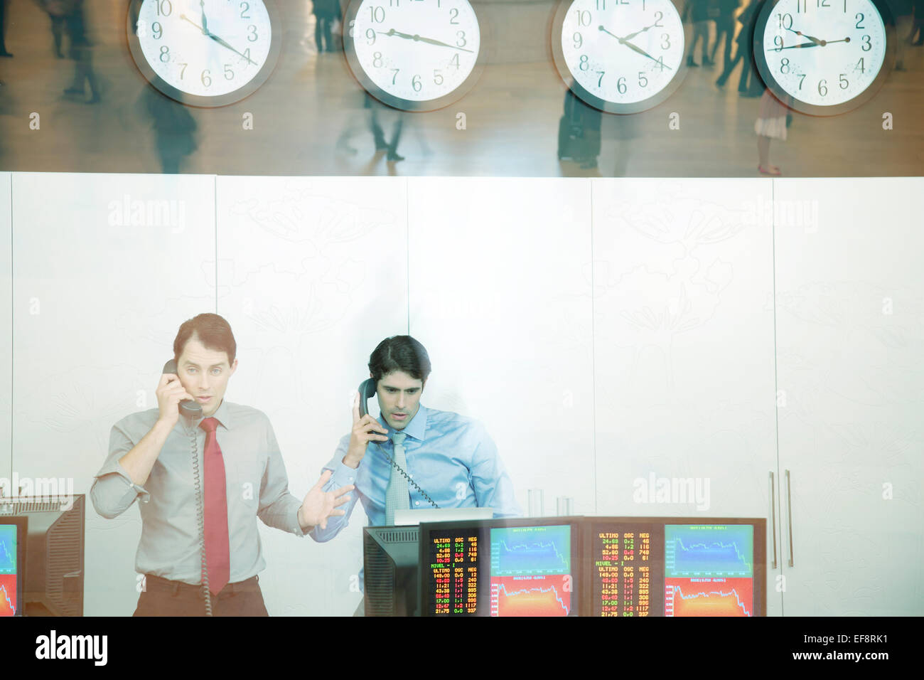 Two traders working in trading room Stock Photo - Alamy