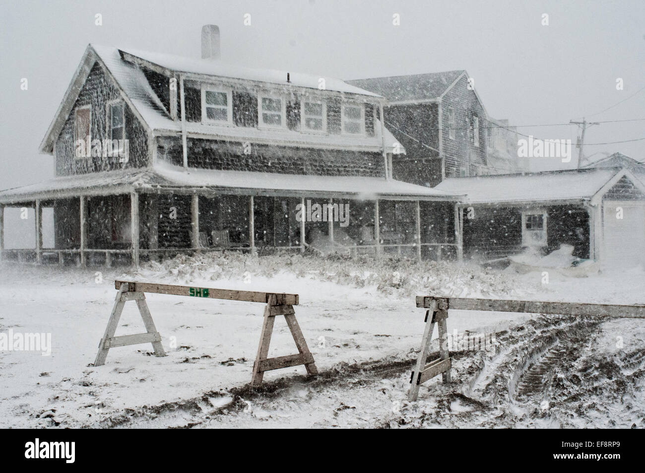 Snow and ice covers a coastal home as winter storm Juno shuts down New ...