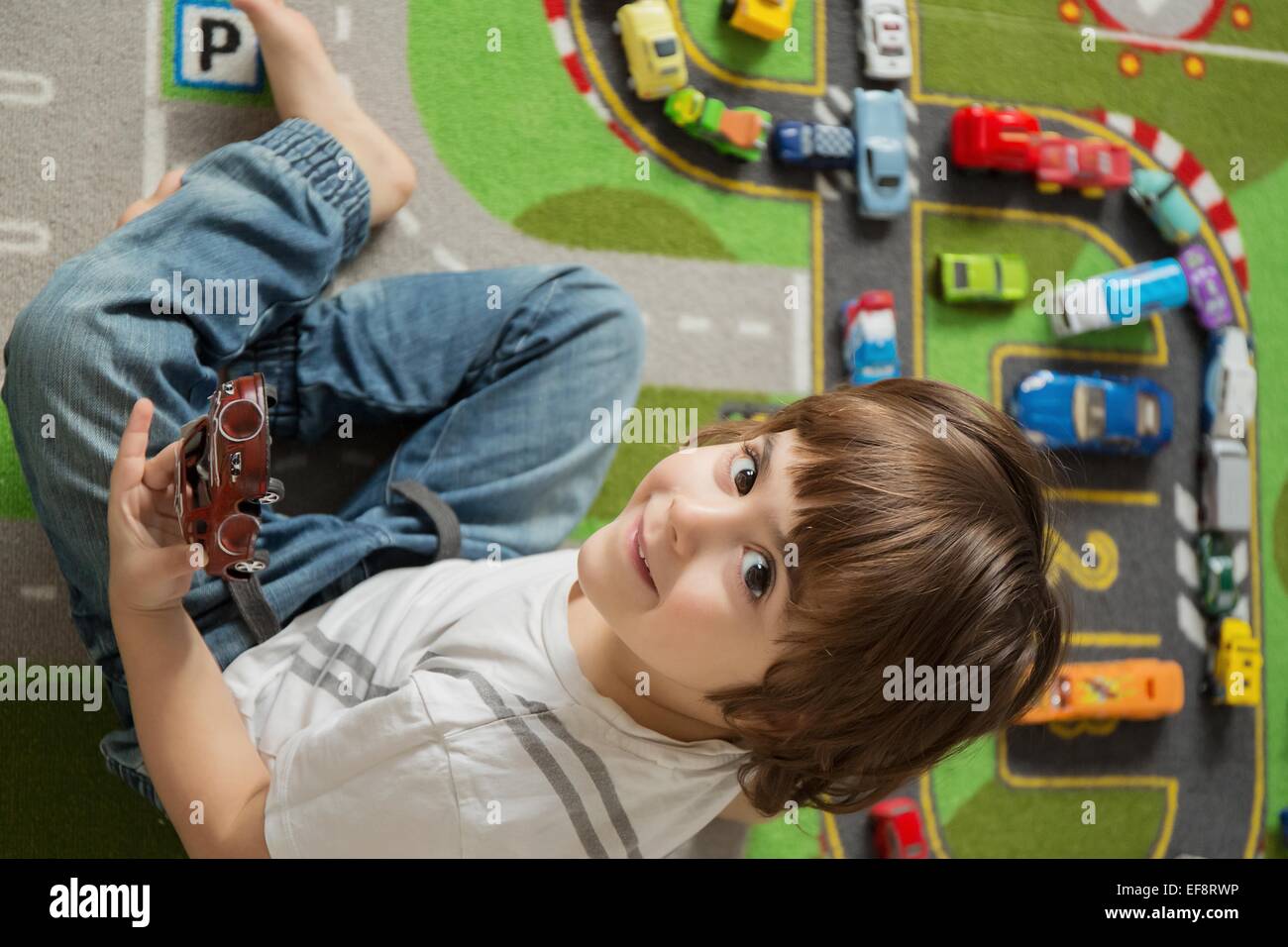 Boy (4-5) playing with cars Stock Photo - Alamy