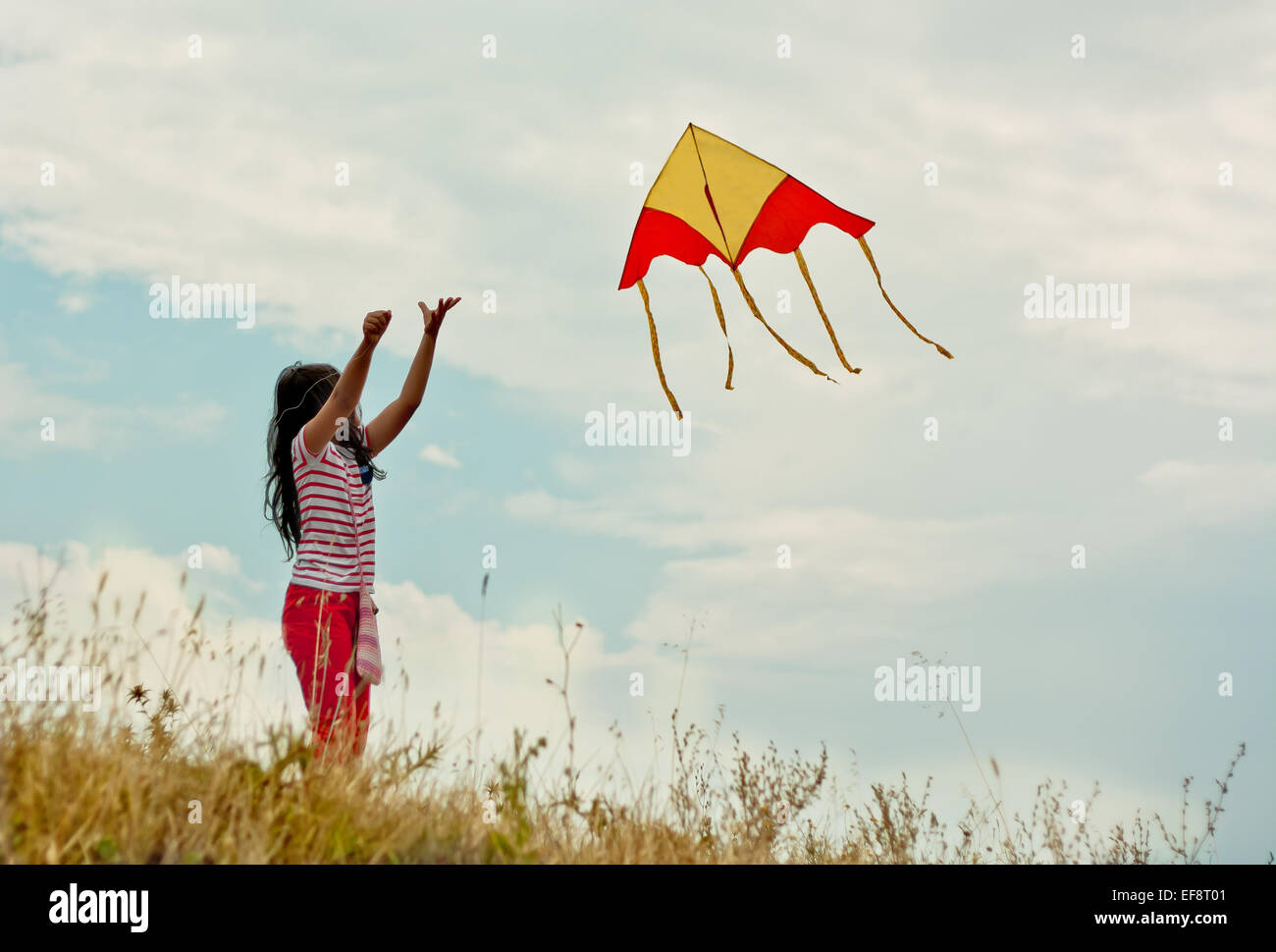 Girl on hill arms hi-res stock photography and images - Alamy