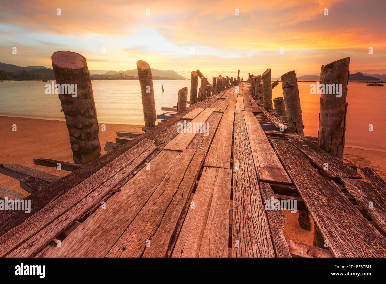 Malaysia, Rustic jetty at sunset Stock Photo - Alamy