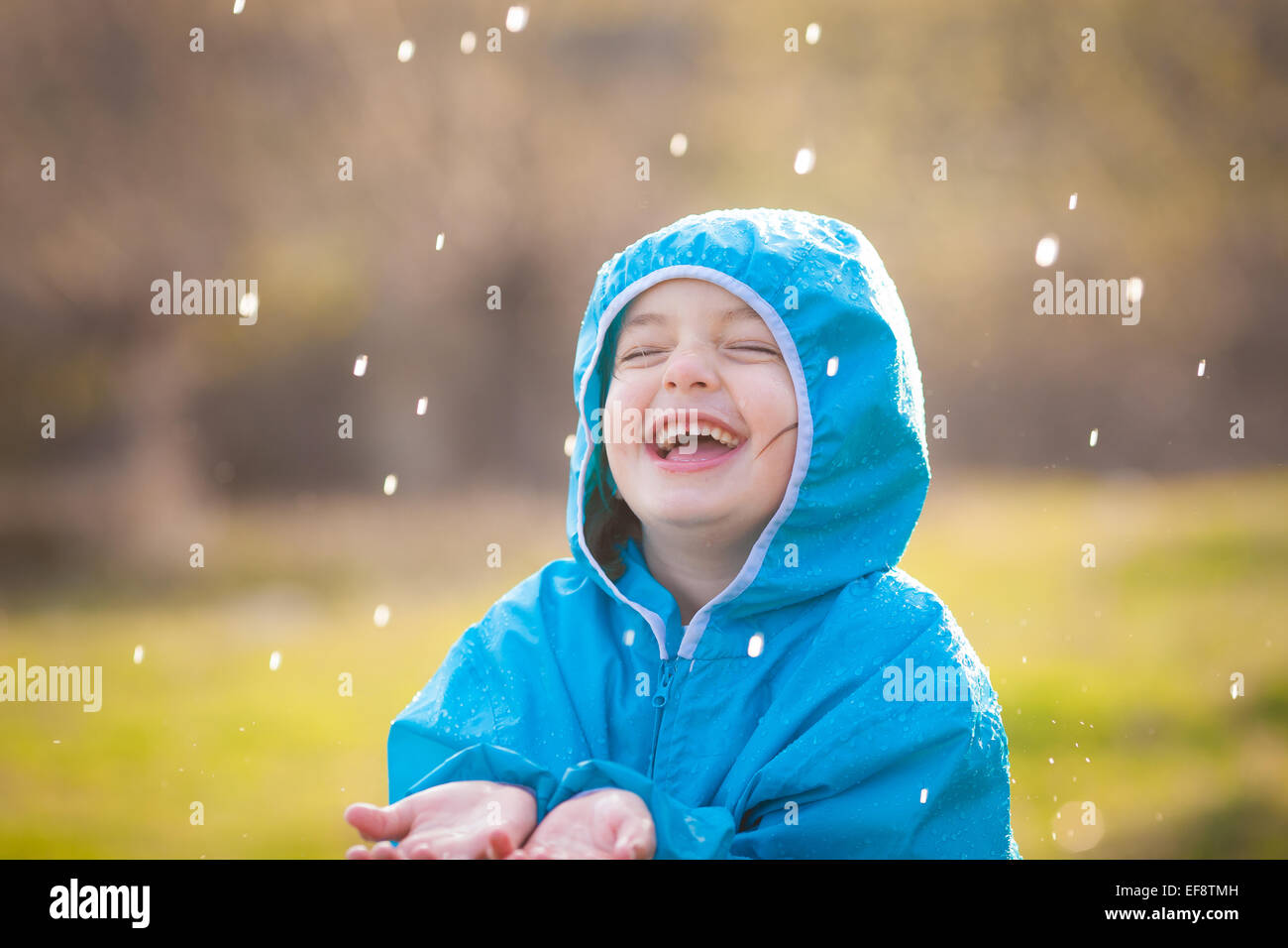Girl (4-5) enjoying rain Stock Photo - Alamy