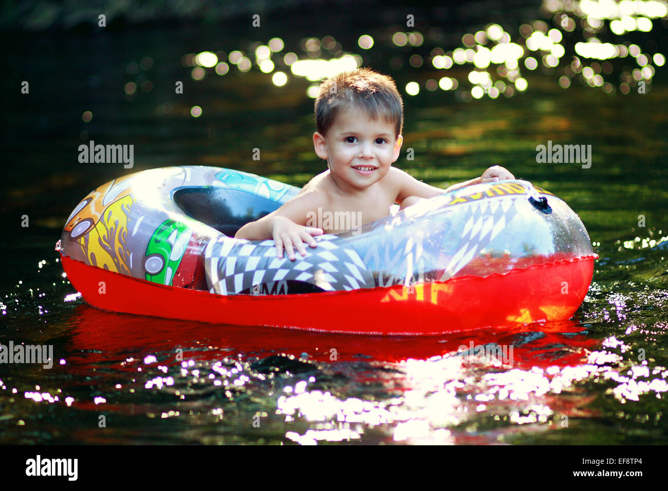 Little boy (2-3) in inflatable kids boat Stock Photo - Alamy