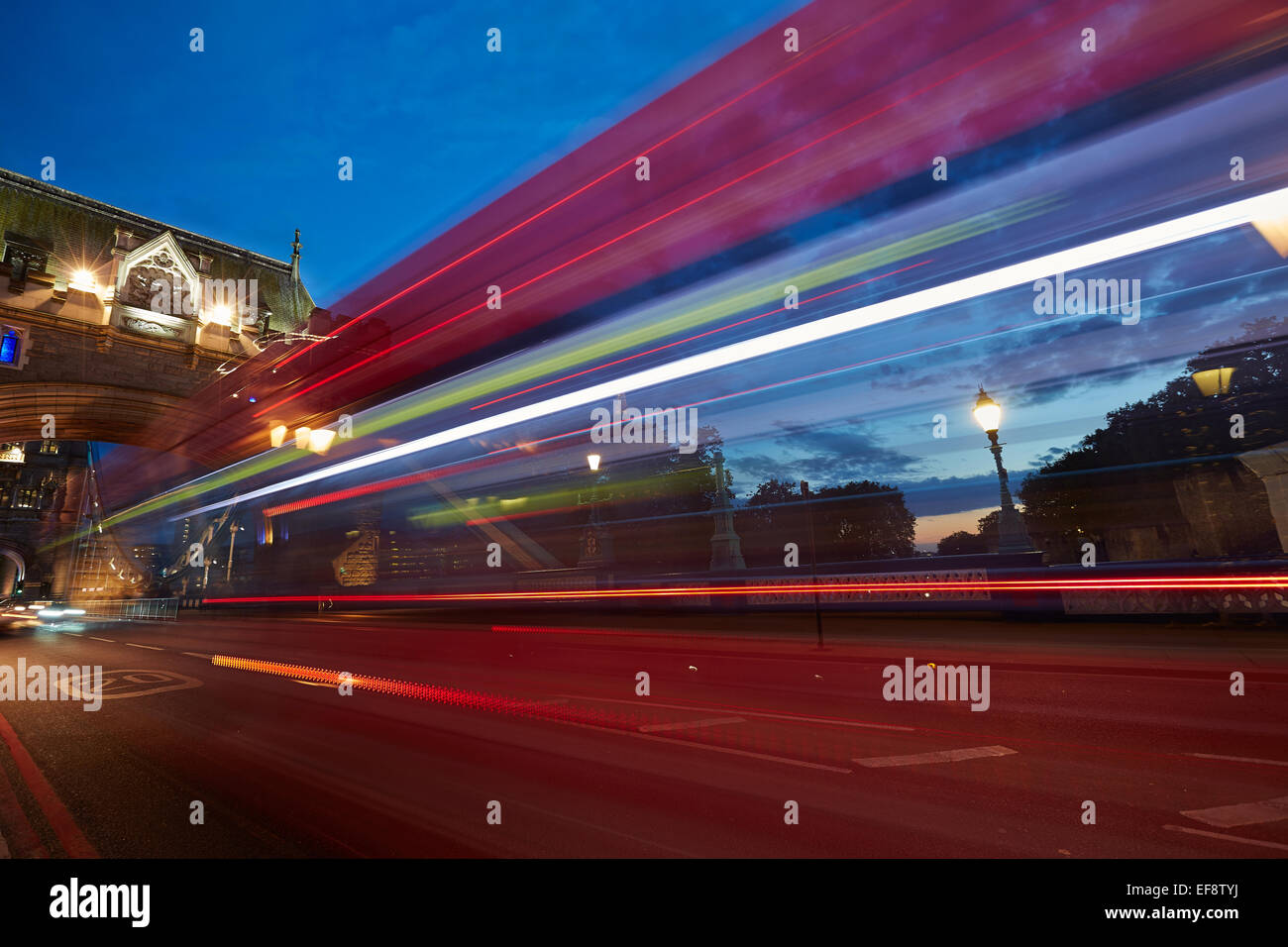 Traffic driving across a bridge at sunset, London, England, United ...