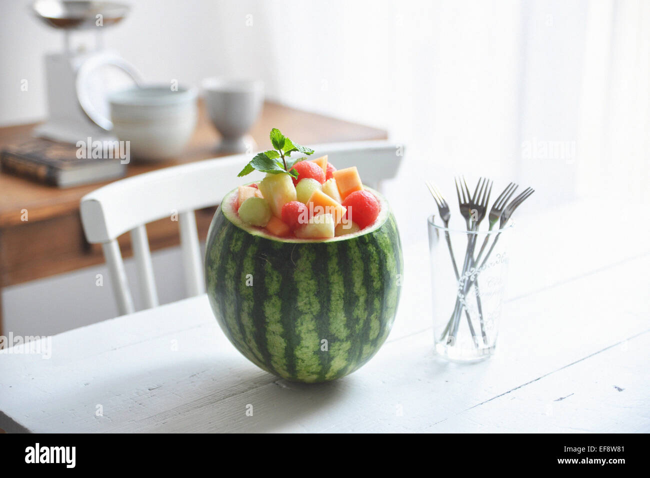 Watermelon bowl filled with fruit salad Stock Photo - Alamy