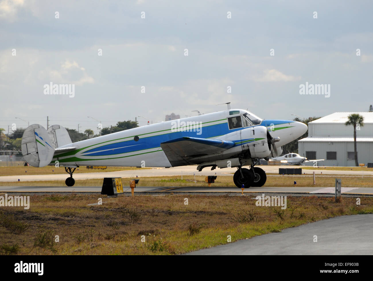 Vintage propeller airplane taxiing on a tarmac Beech C-18 Stock Photo ...