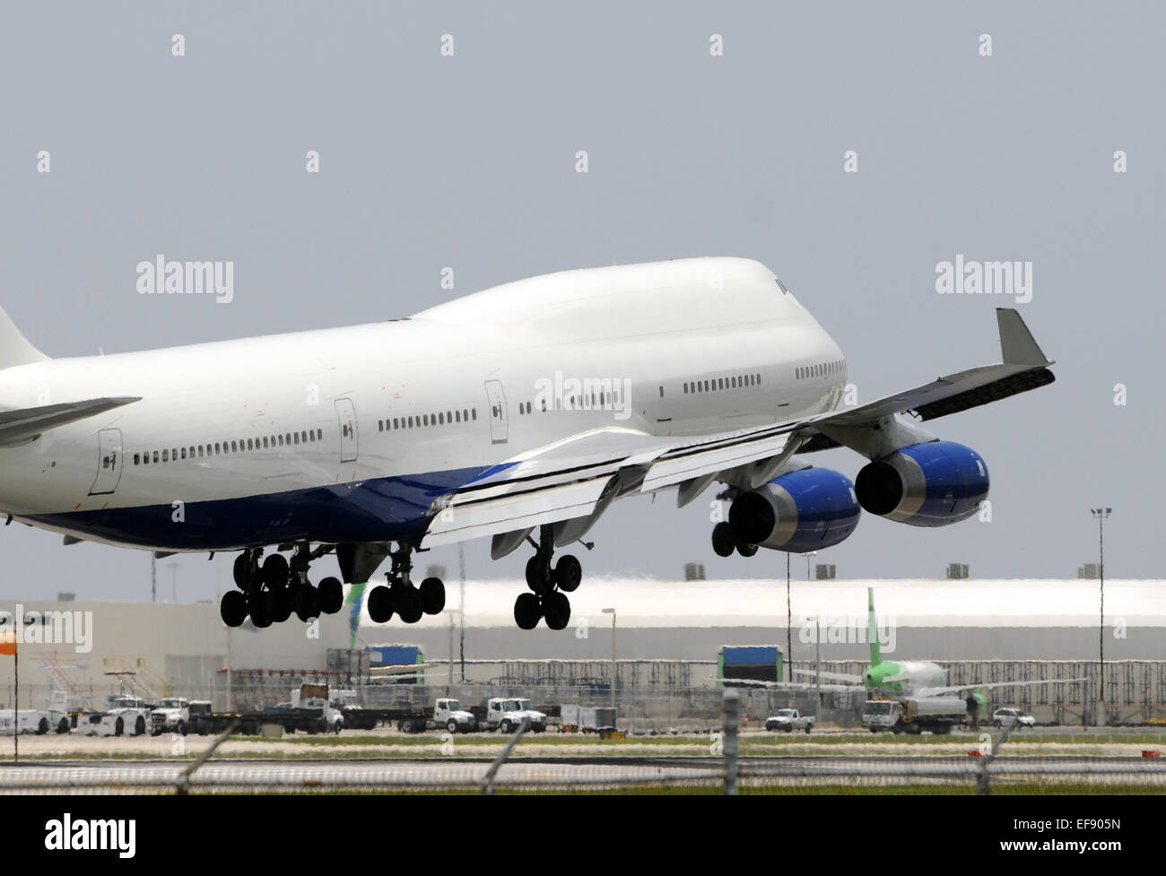 Heavy passenger jet landing at airport Boeing 747 Stock Photo - Alamy