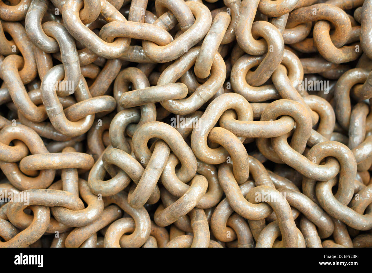 Old rusty chain put together the background Stock Photo - Alamy