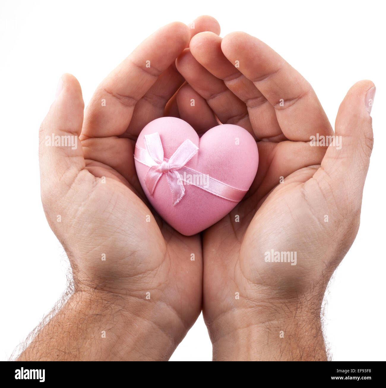 Pink heart in male hands on a white background Stock Photo - Alamy