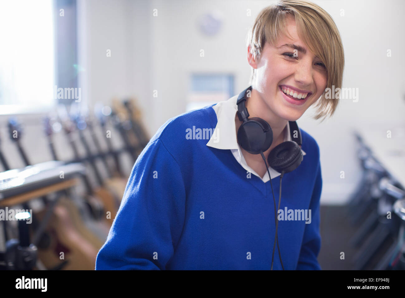 Portrait of female student with headphones in classroom Stock Photo - Alamy