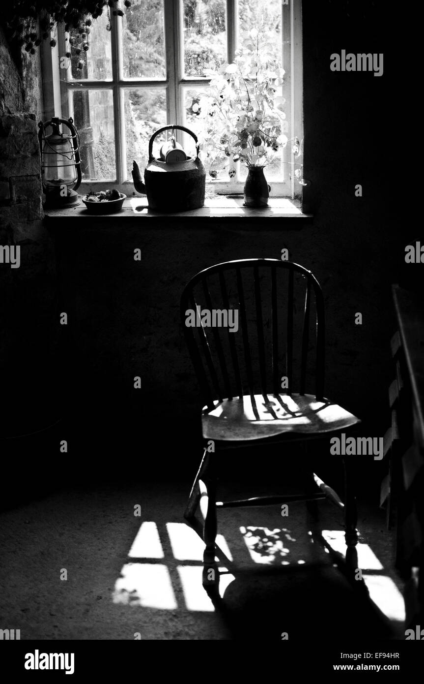 The sun shines through the window of an old small cottage. A beautiful ...