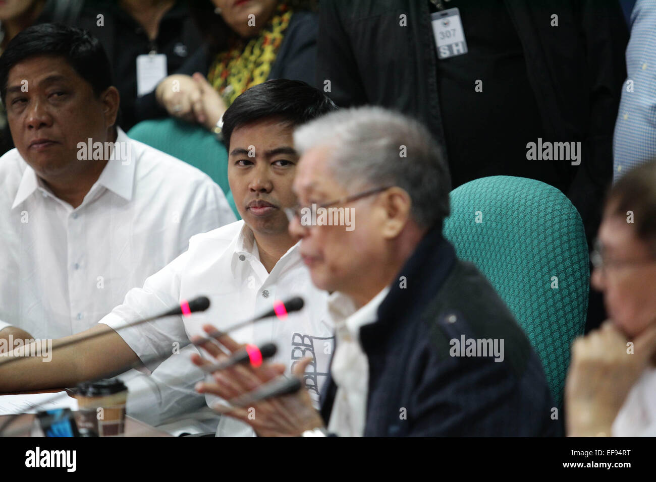 Makati Mayor Jejomar Erwin "Junjun" Binay Jr (2nd from left) listens to ...