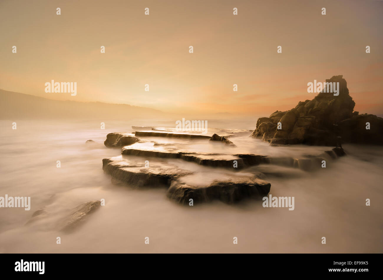 Azkorri beach with long exposure at sunset Stock Photo - Alamy