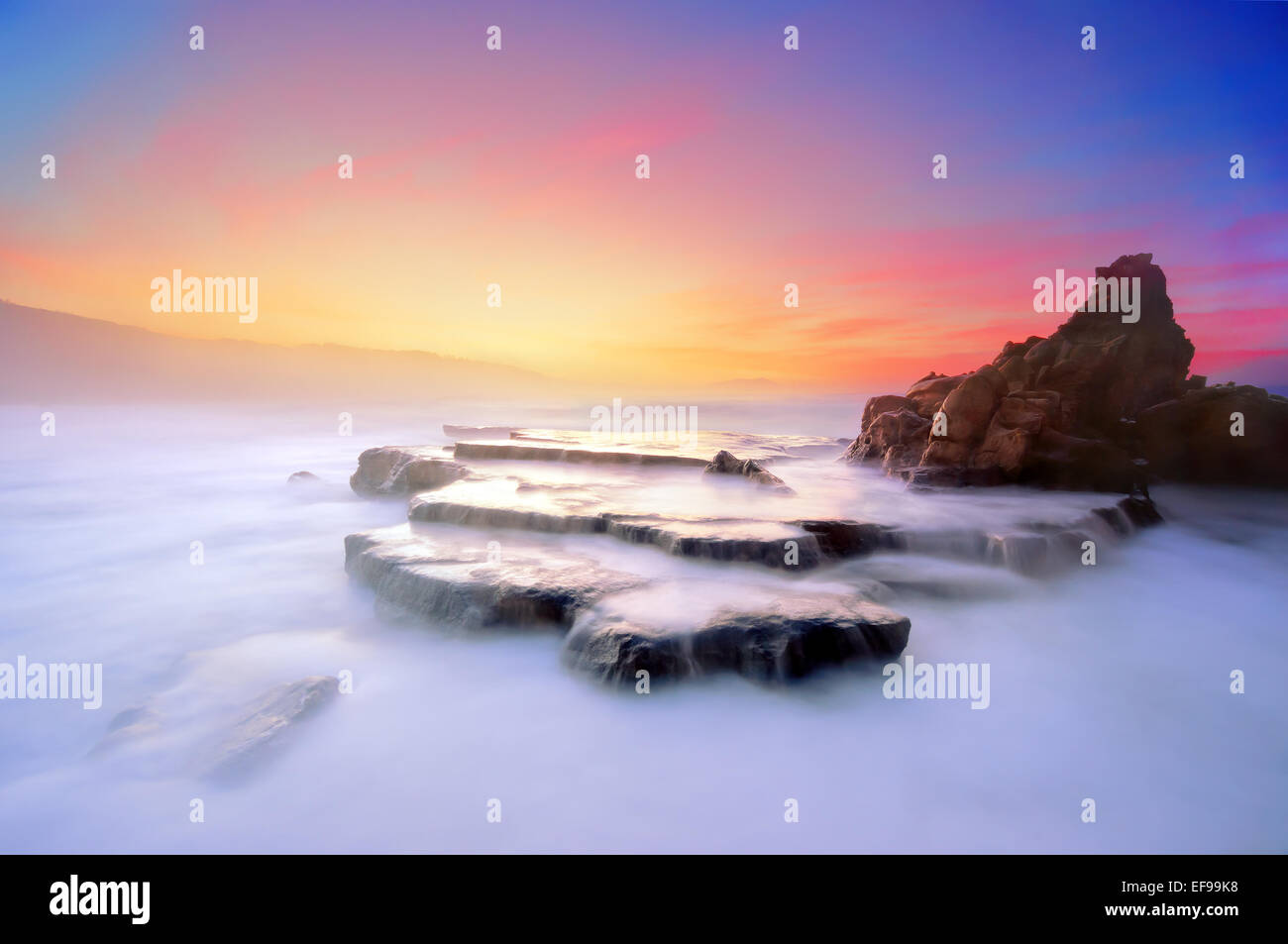 Azkorri beach with long exposure at sunset with vivid colors Stock ...