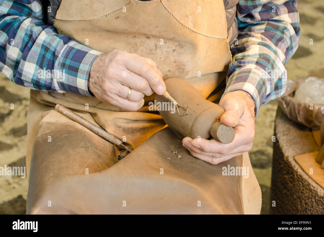 Old hands of a potter shaping a clay figure Stock Photo - Alamy