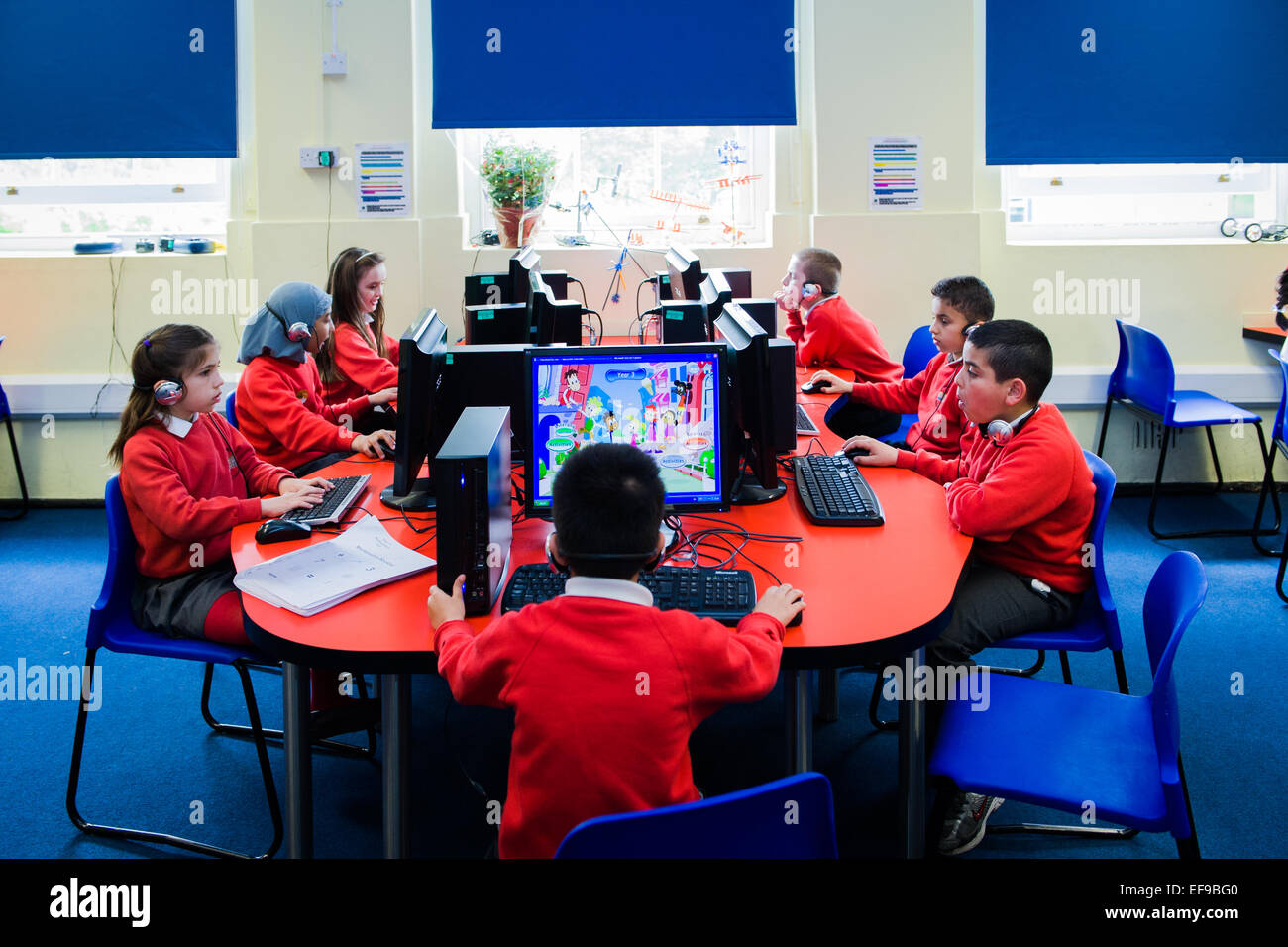 Primary children at a computer suite in a UK Primary school Stock Photo ...