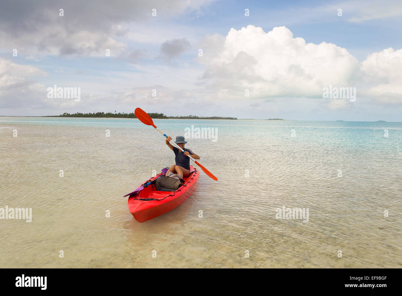 Exploring the gorgeous lagoon of Aitutaki by canoeing. Tropical stormy ...