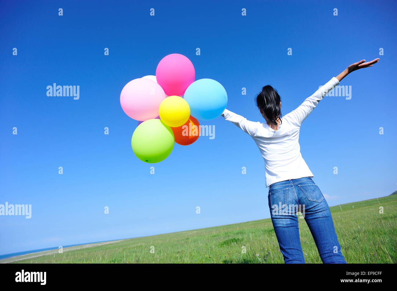 one young asian woman with colorful balloons Stock Photo - Alamy