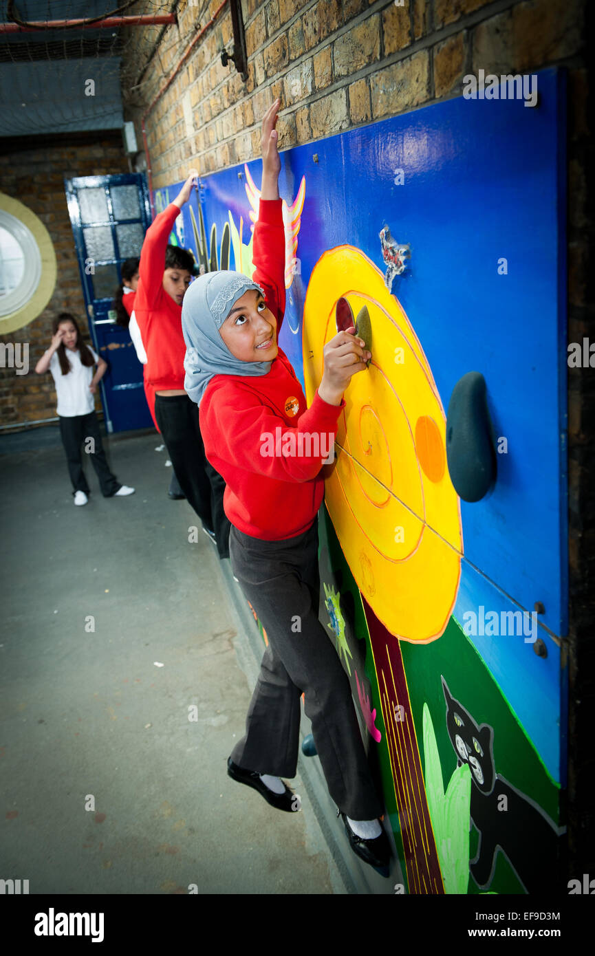 School aged children climbing hi-res stock photography and images - Alamy