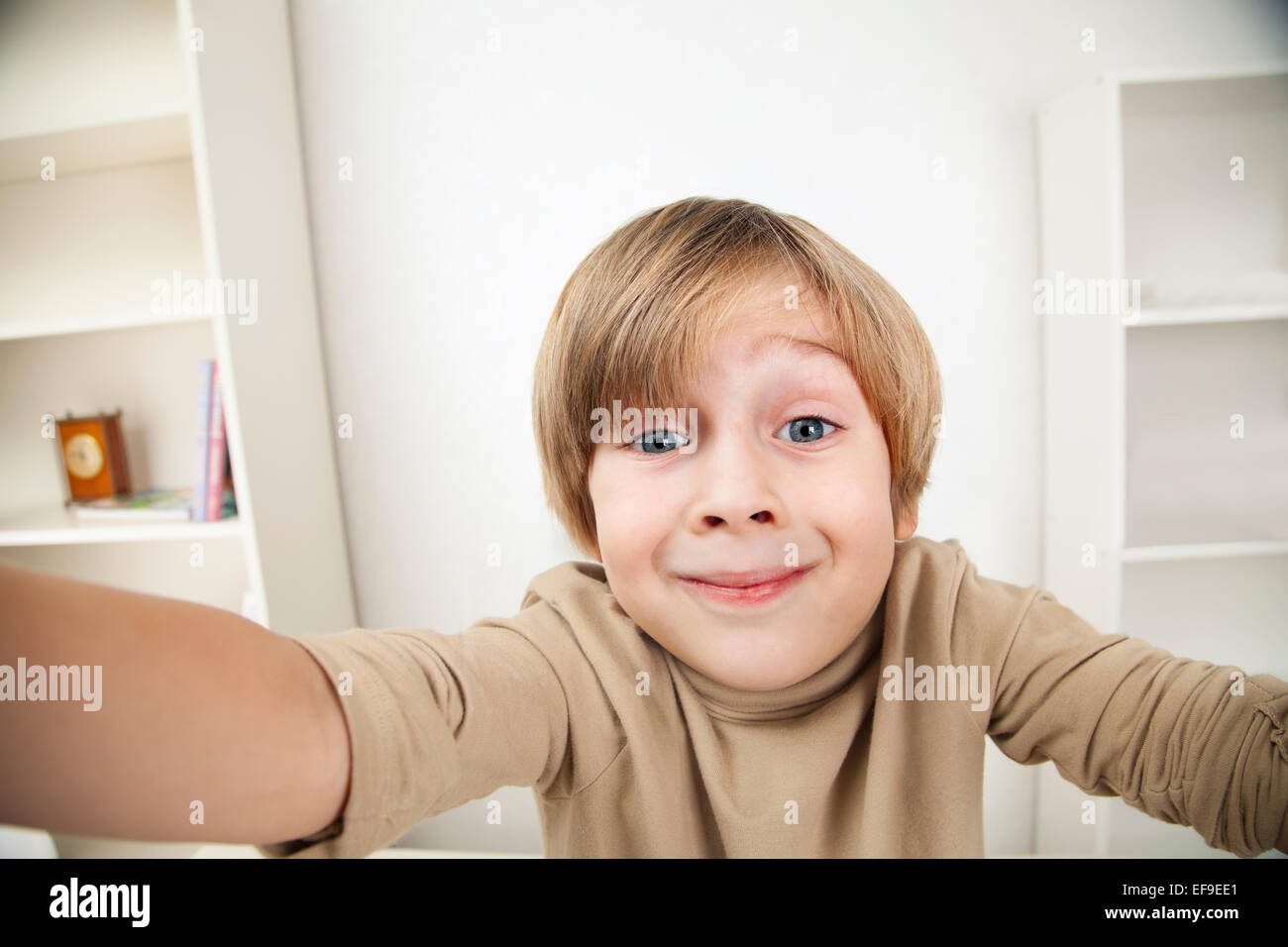 Handsome smiling boy in front Stock Photo - Alamy