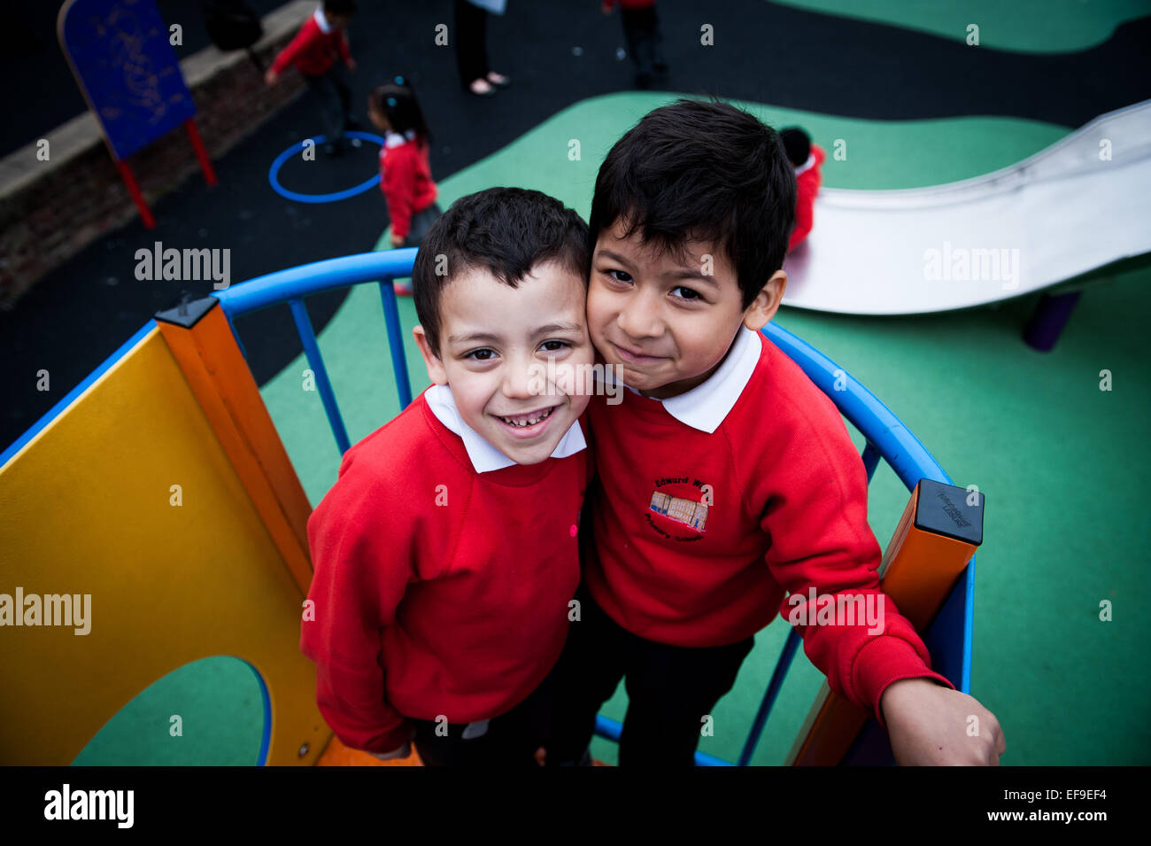 Happy smiling boys playing in the playground of Primary school in ...