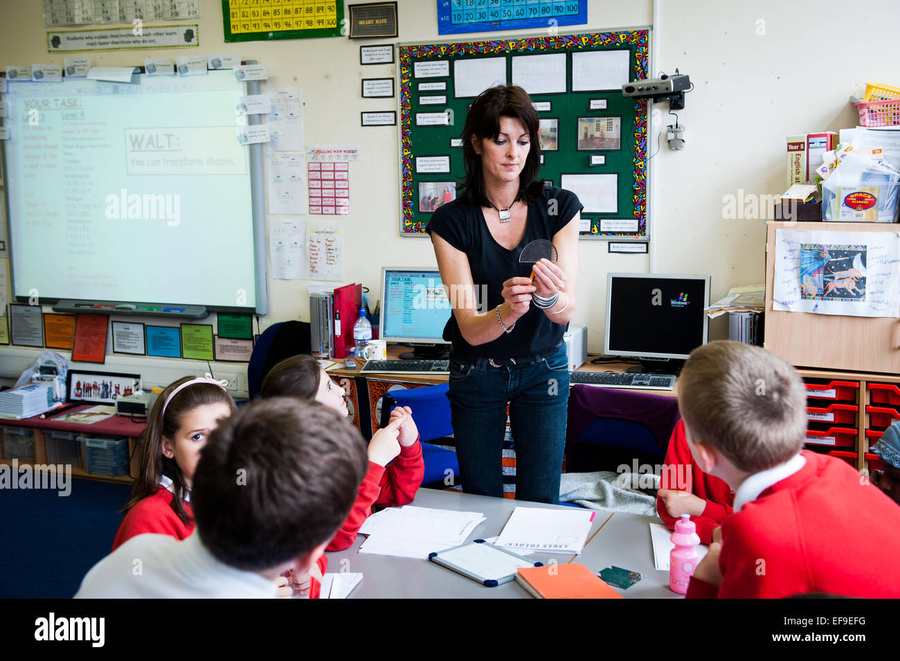 Teachers and Primary school children at Primary School Stock Photo - Alamy