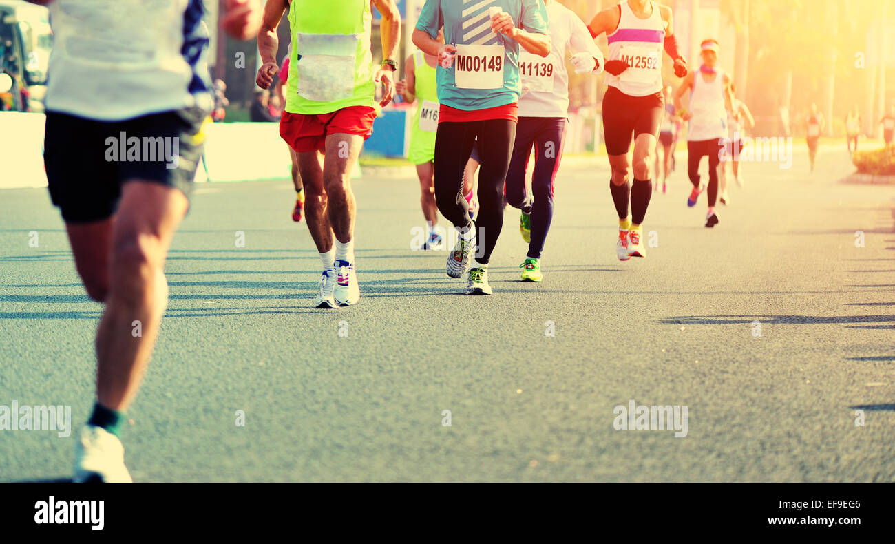 marathon runners runnning on city road Stock Photo - Alamy