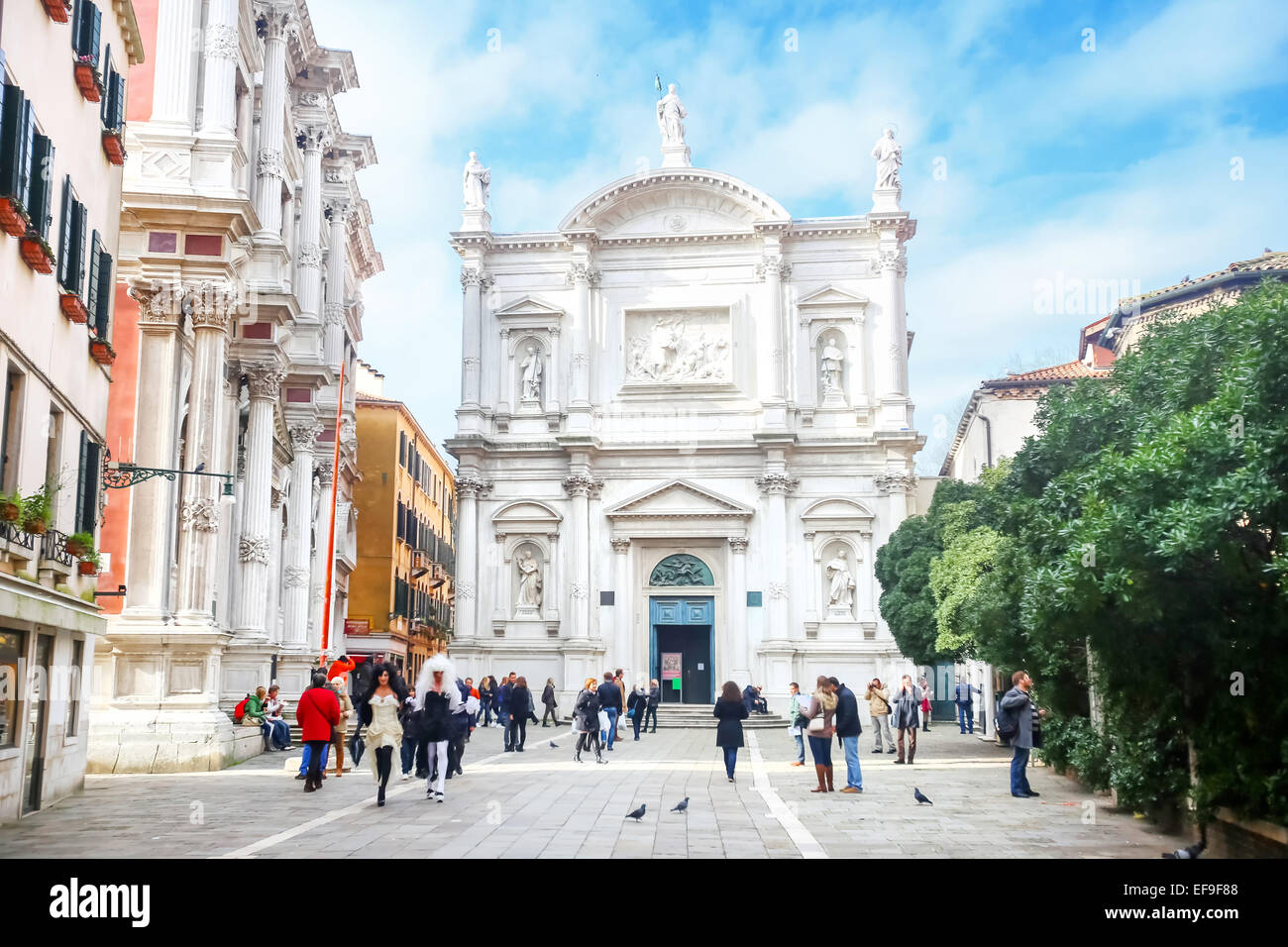People walking in the square San Rocco in front of a renaissance palace ...