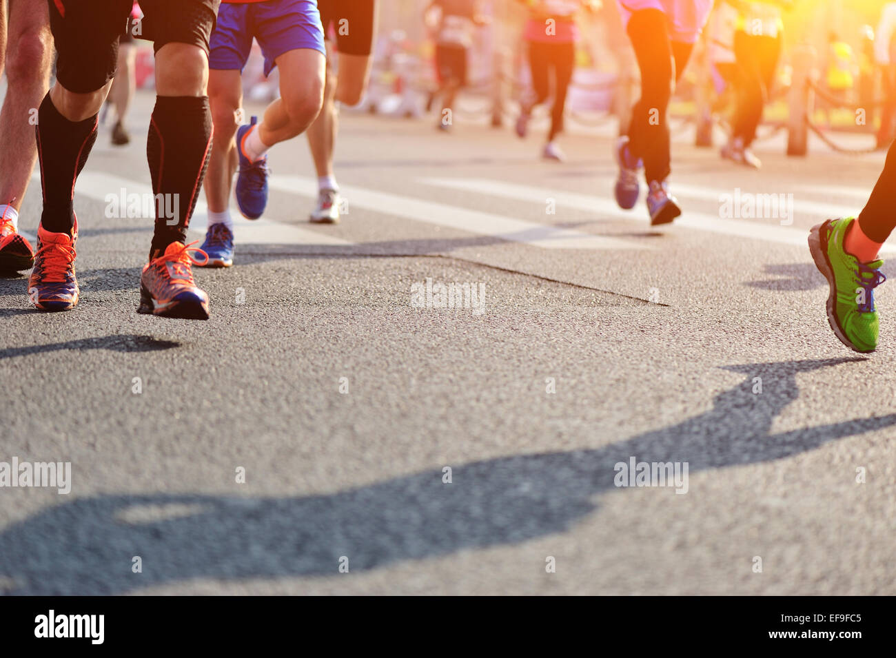 marathon runners runnning on city road Stock Photo - Alamy