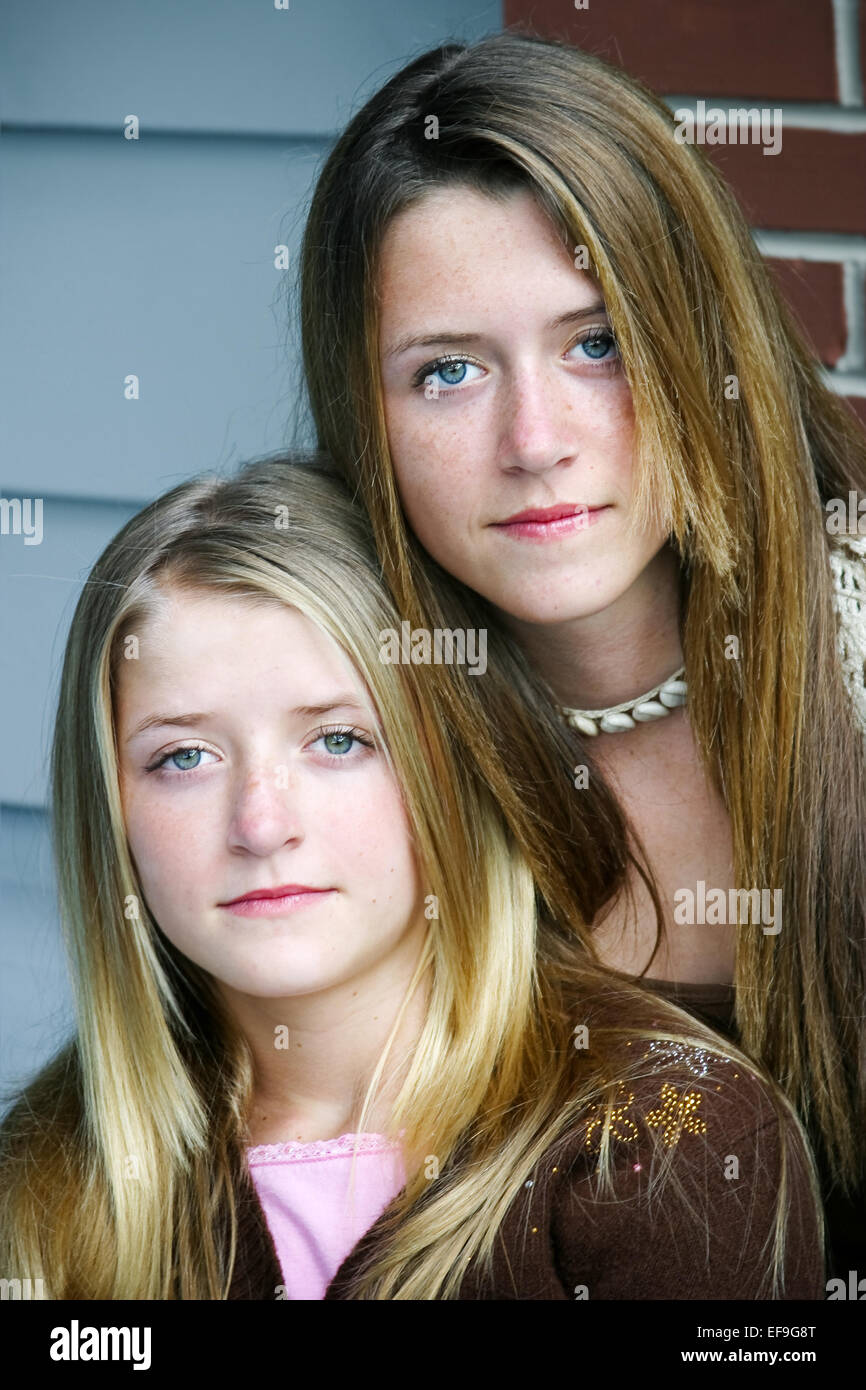 Portrait of beautiful teenage sisters, serious expressions Stock Photo ...