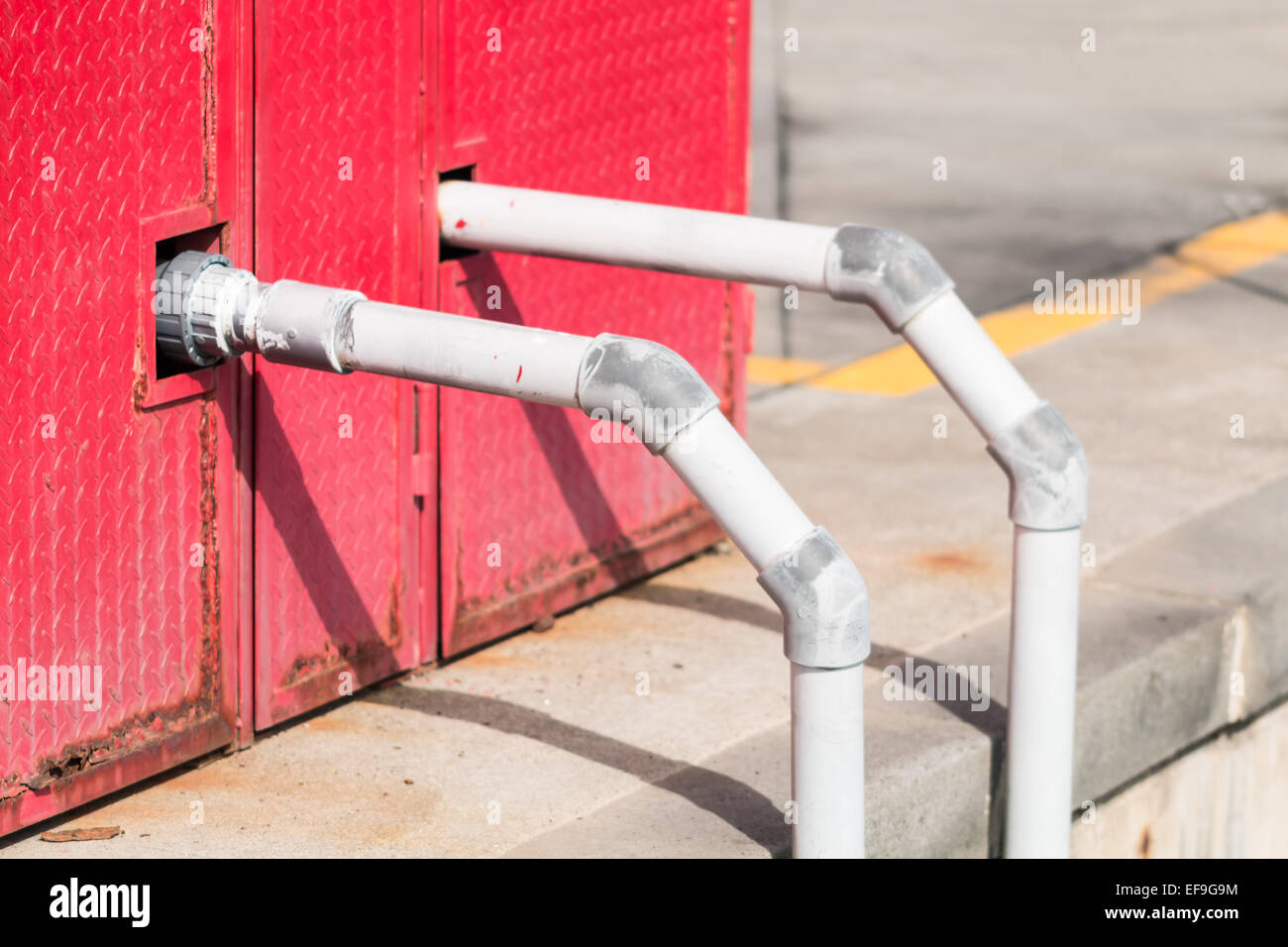 Drainage pipes that come out from metal caisson Stock Photo - Alamy