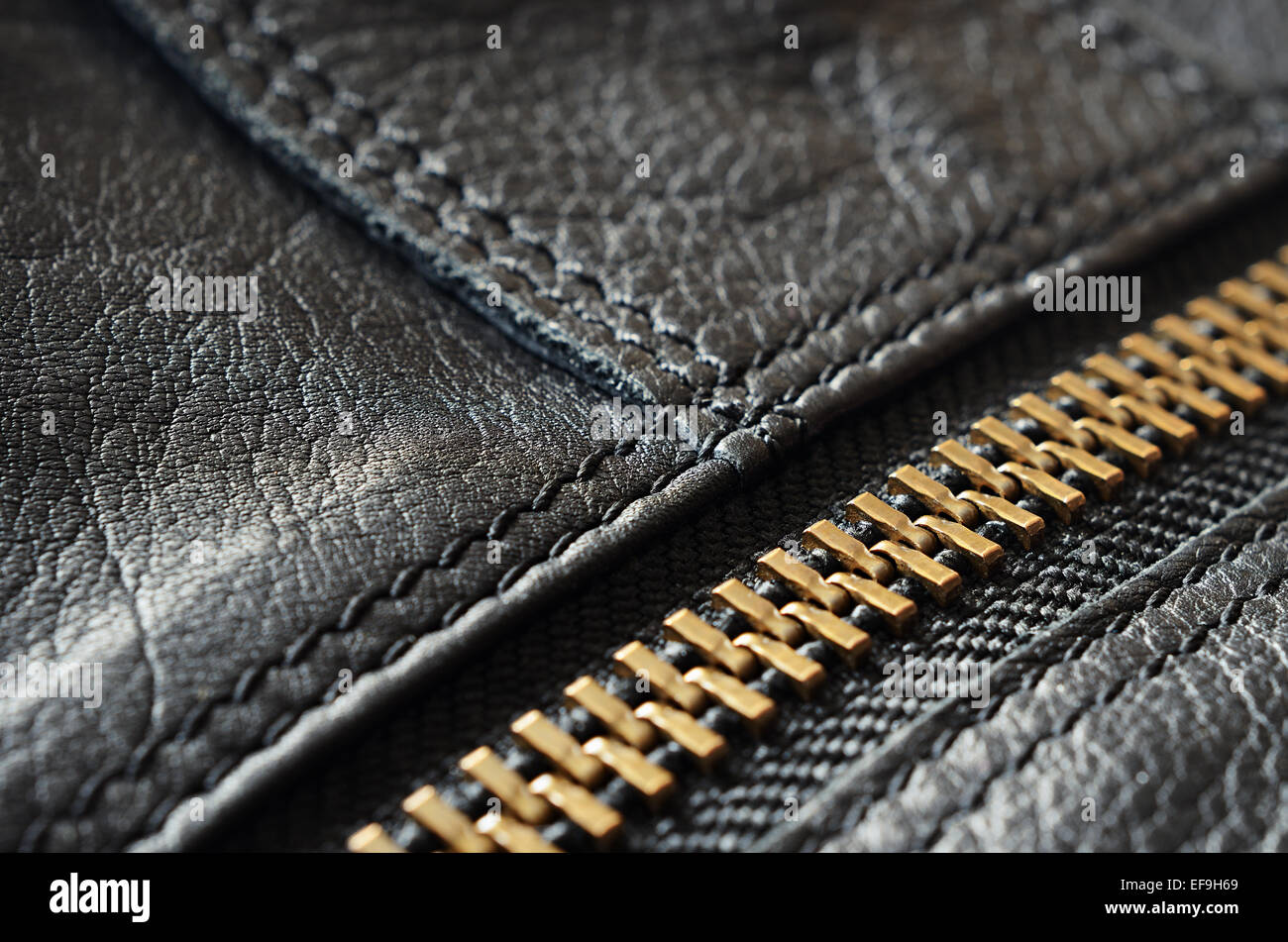 Black leather bag part with zip for background Stock Photo - Alamy
