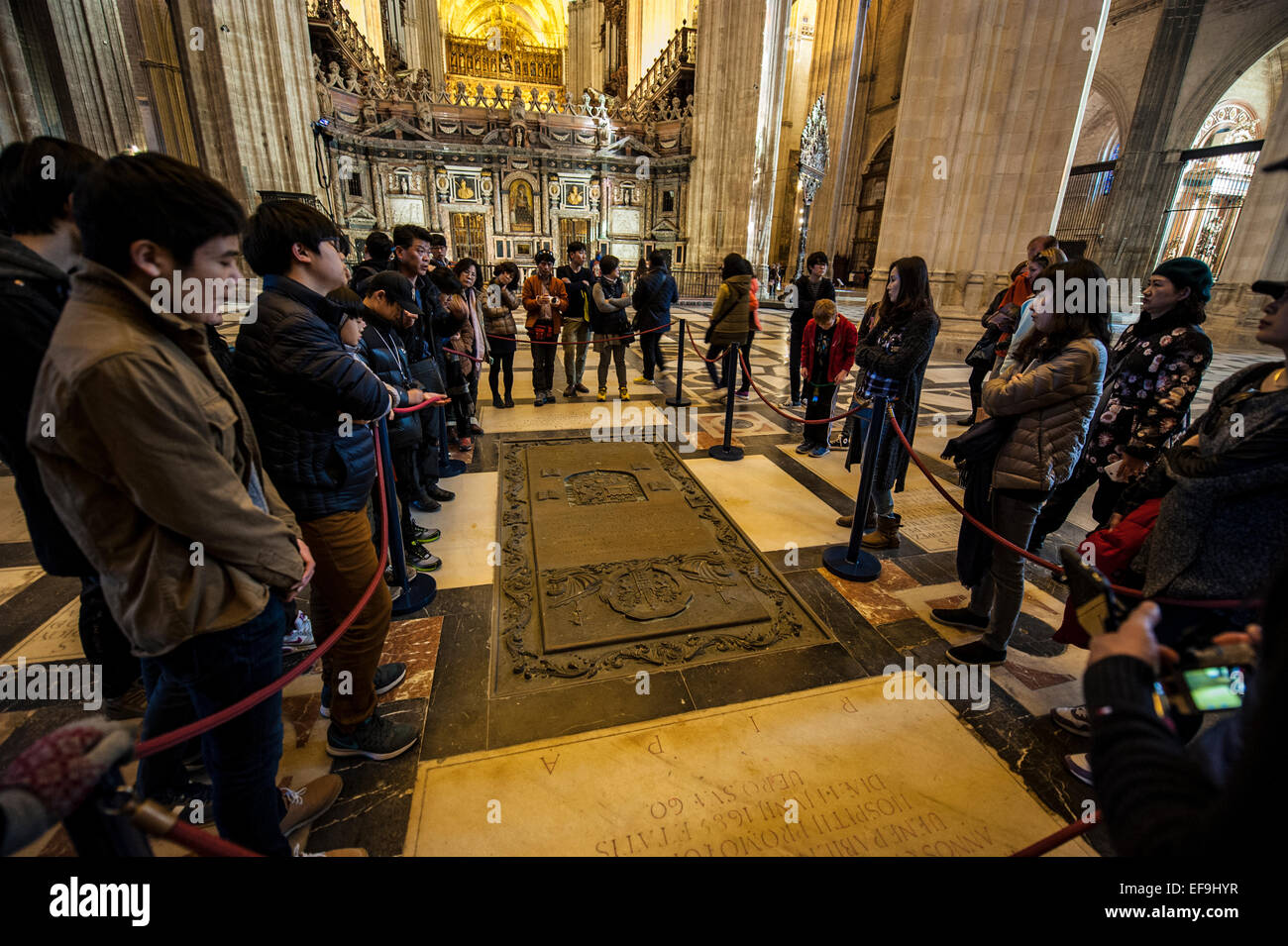 A group of Asian tourists inside the Seville Cathedral, Spain Stock ...