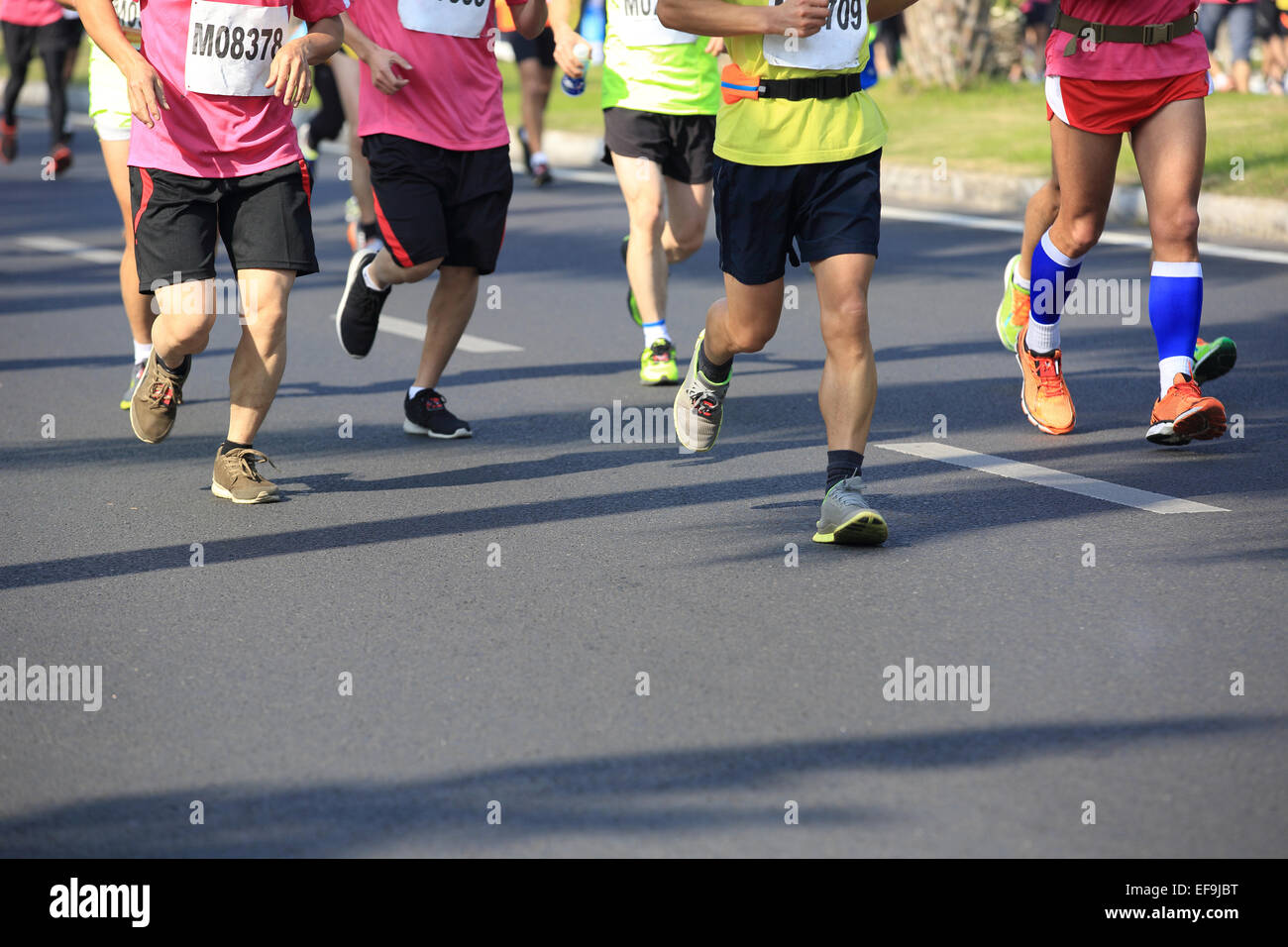marathon runners runnning on city road Stock Photo - Alamy