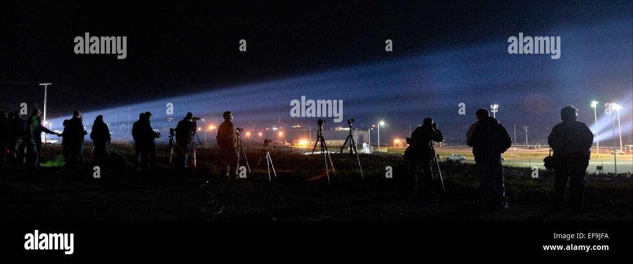 Vandenberg AFB, California- News media photographers and reporters watch the tower rolls back ...