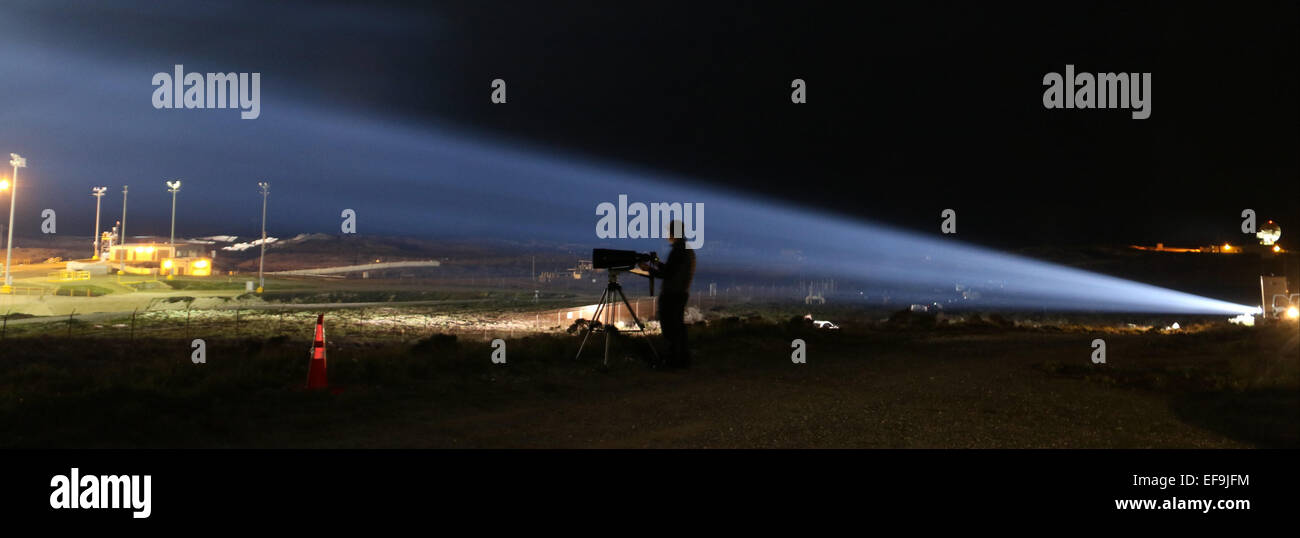 Vandenberg AFB, California- News media photographers and reporters watch the tower rolls back ...
