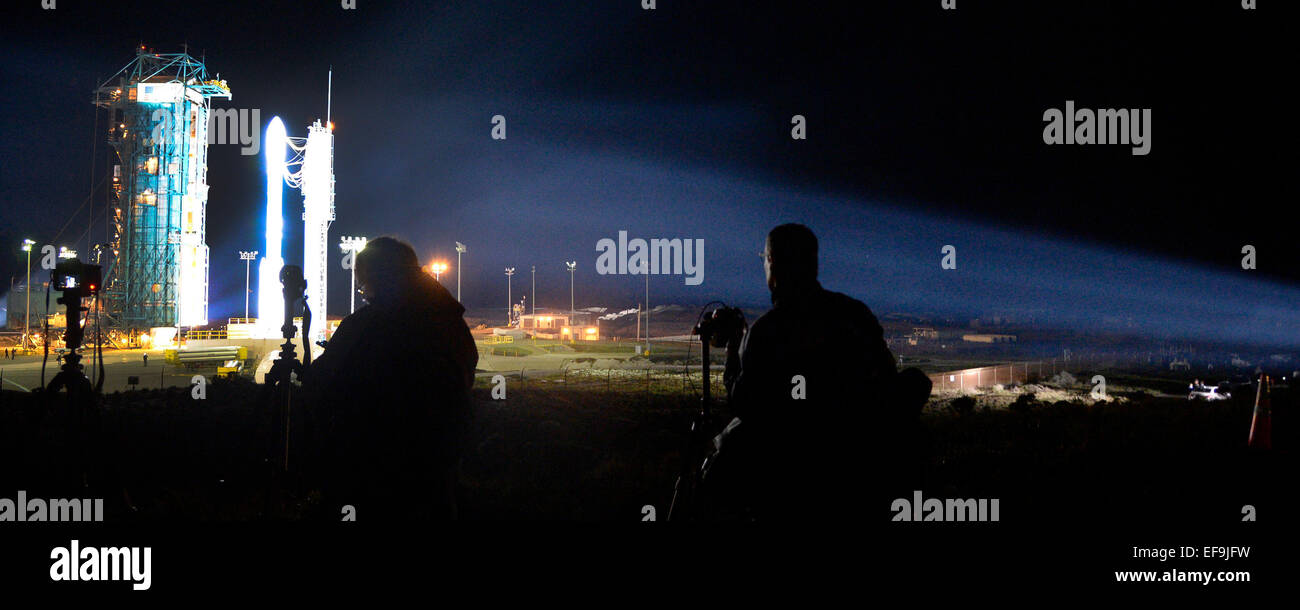 Vandenberg AFB, California- News media photographers and reporters watch the tower rolls back ...