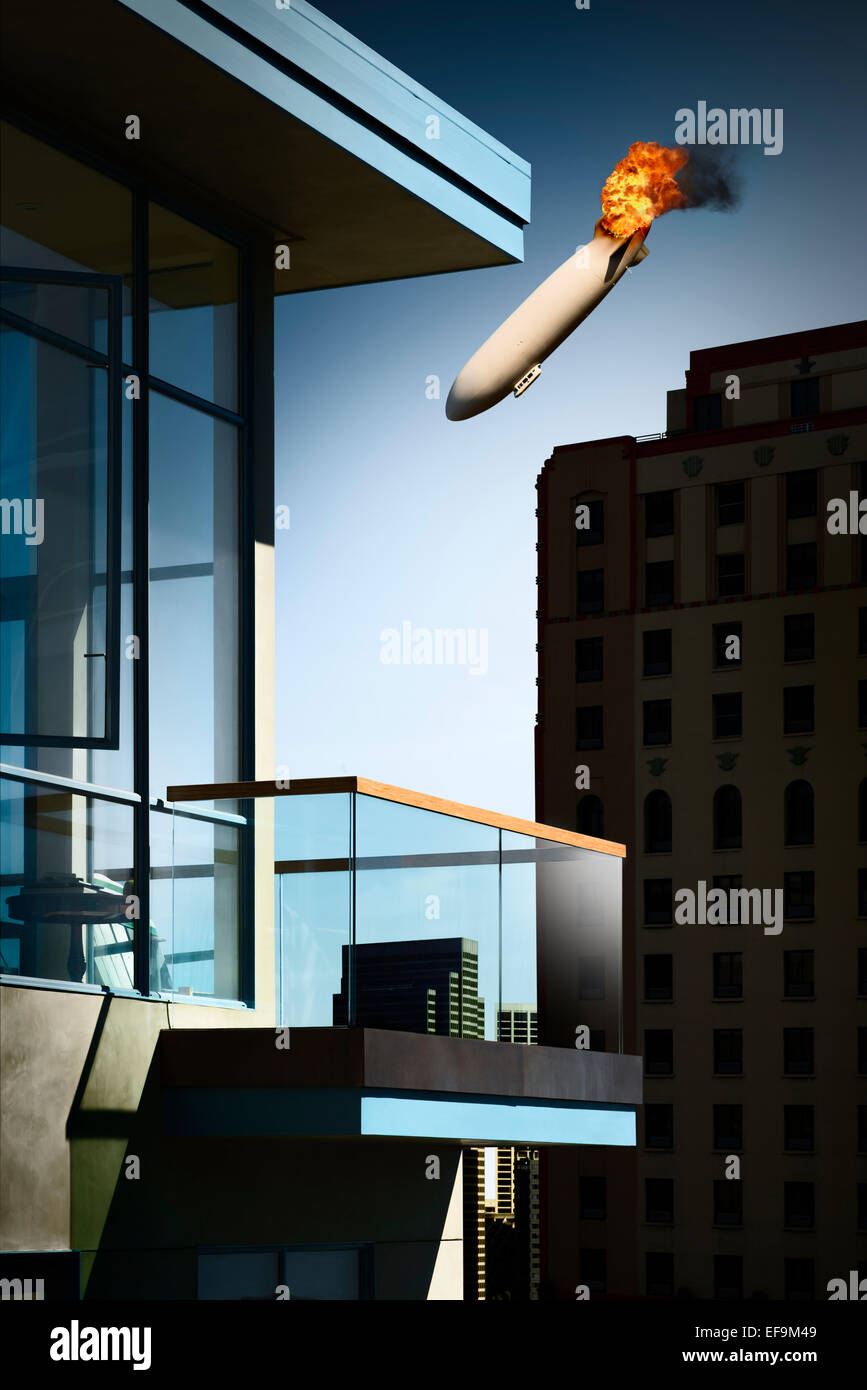 View of city from empty balcony of apartment building with burning ...