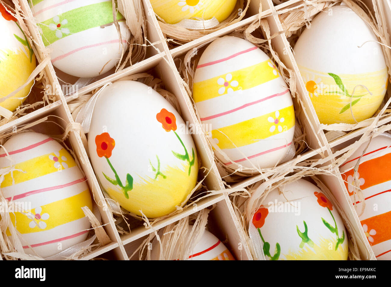 assorted colorful painted easter eggs in a wodden box Stock Photo - Alamy
