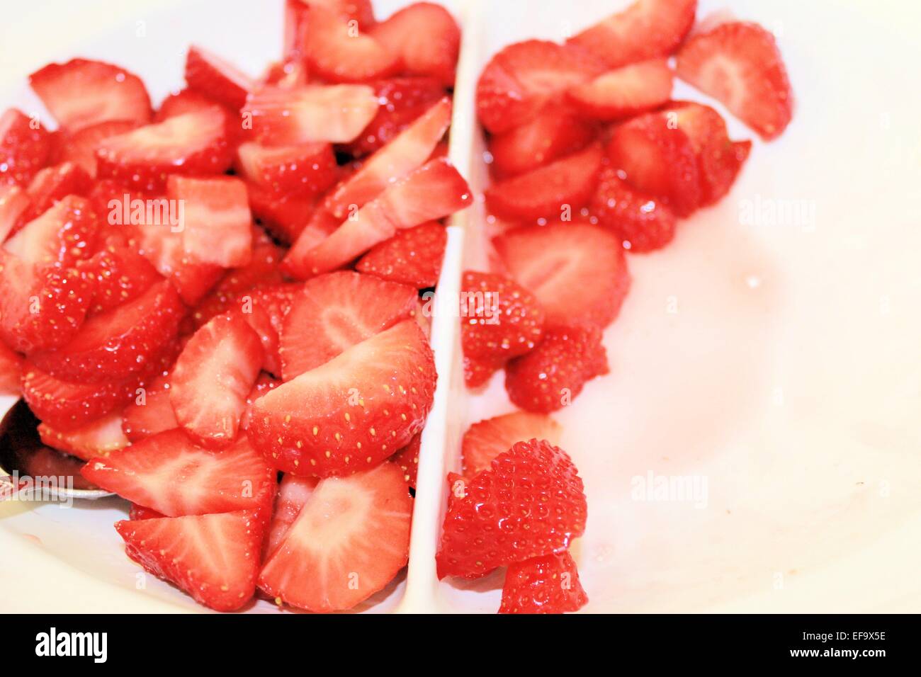 strawberries cut into pieces Stock Photo - Alamy