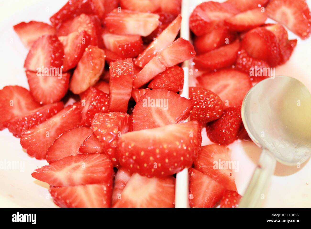 strawberries cut into pieces Stock Photo - Alamy