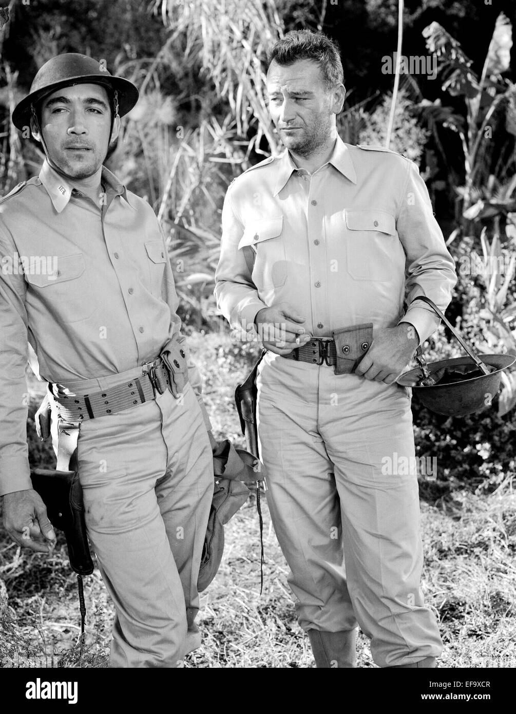 ANTHONY QUINN, JOHN WAYNE, BACK TO BATAAN, 1945 Stock Photo - Alamy
