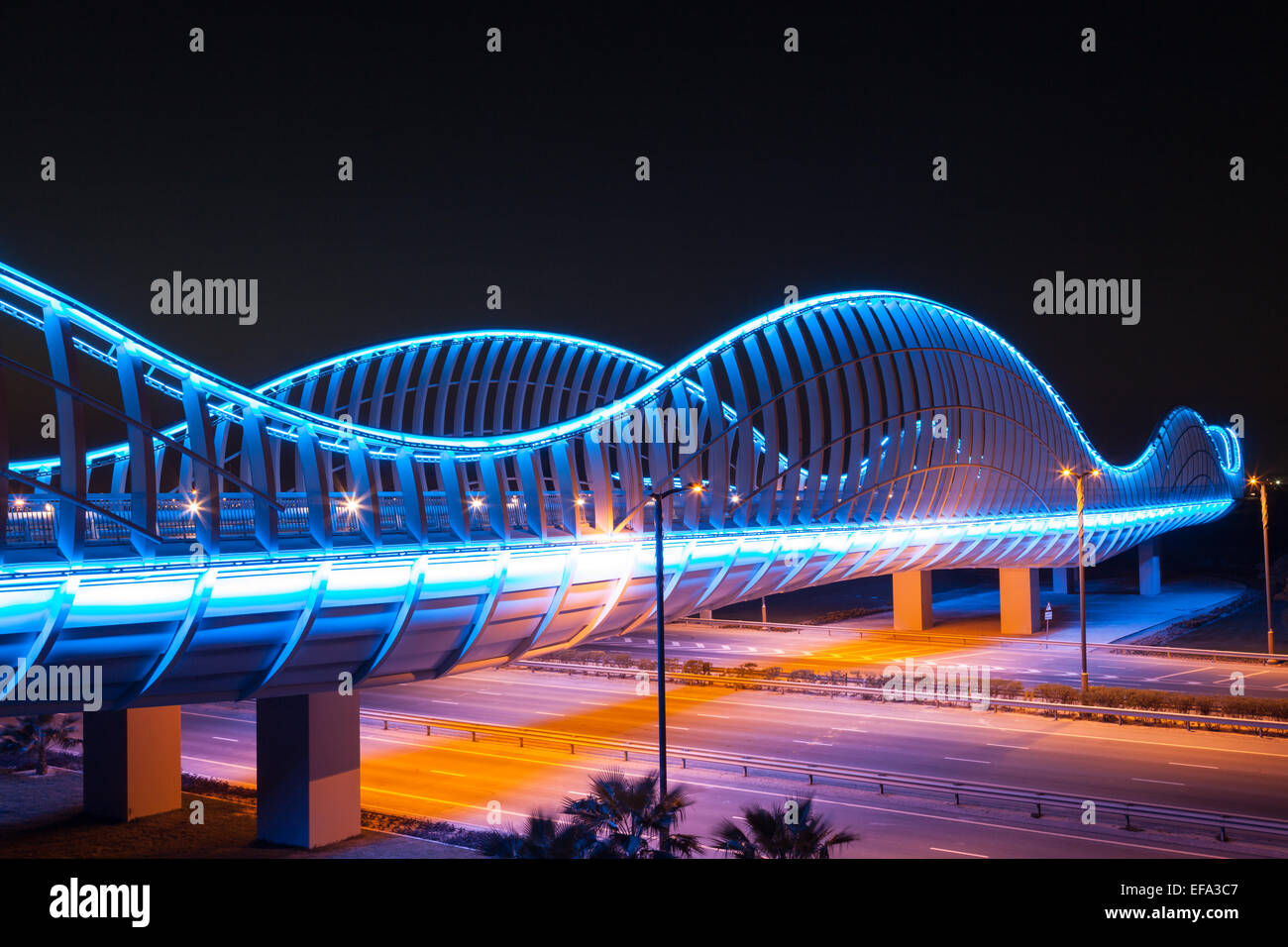 Wave shaped Meydan Bridge in Dubai illuminated at night. Dubai, United ... Wave shaped Meydan Bridge in Dubai illuminated at night. Dubai, United ...