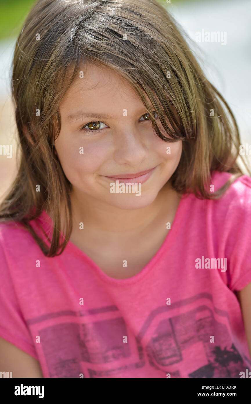 Adorable preteen smiling in natural light Stock Photo - Alamy