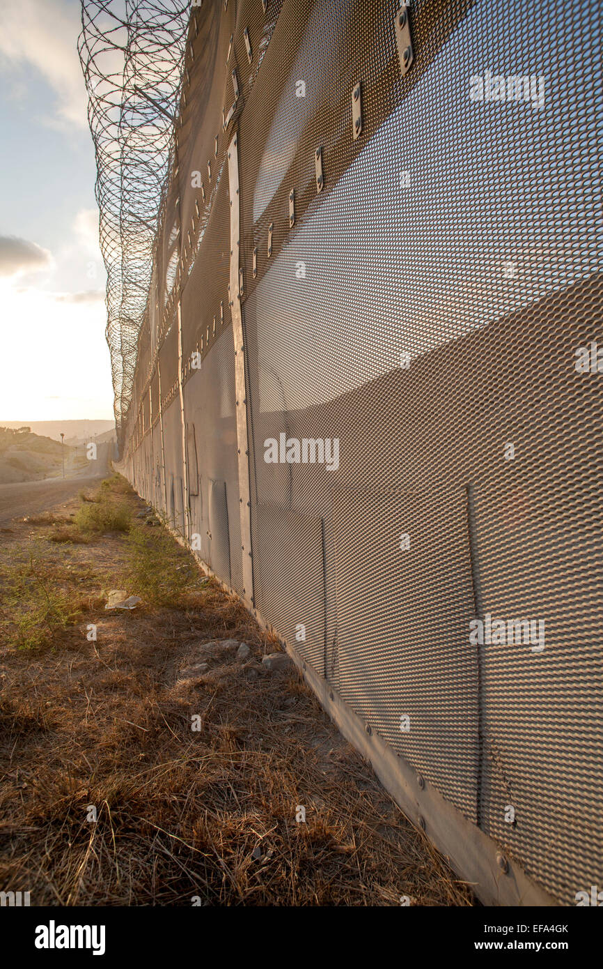Patched holes in the international fence on the U.S./Mexico border ...