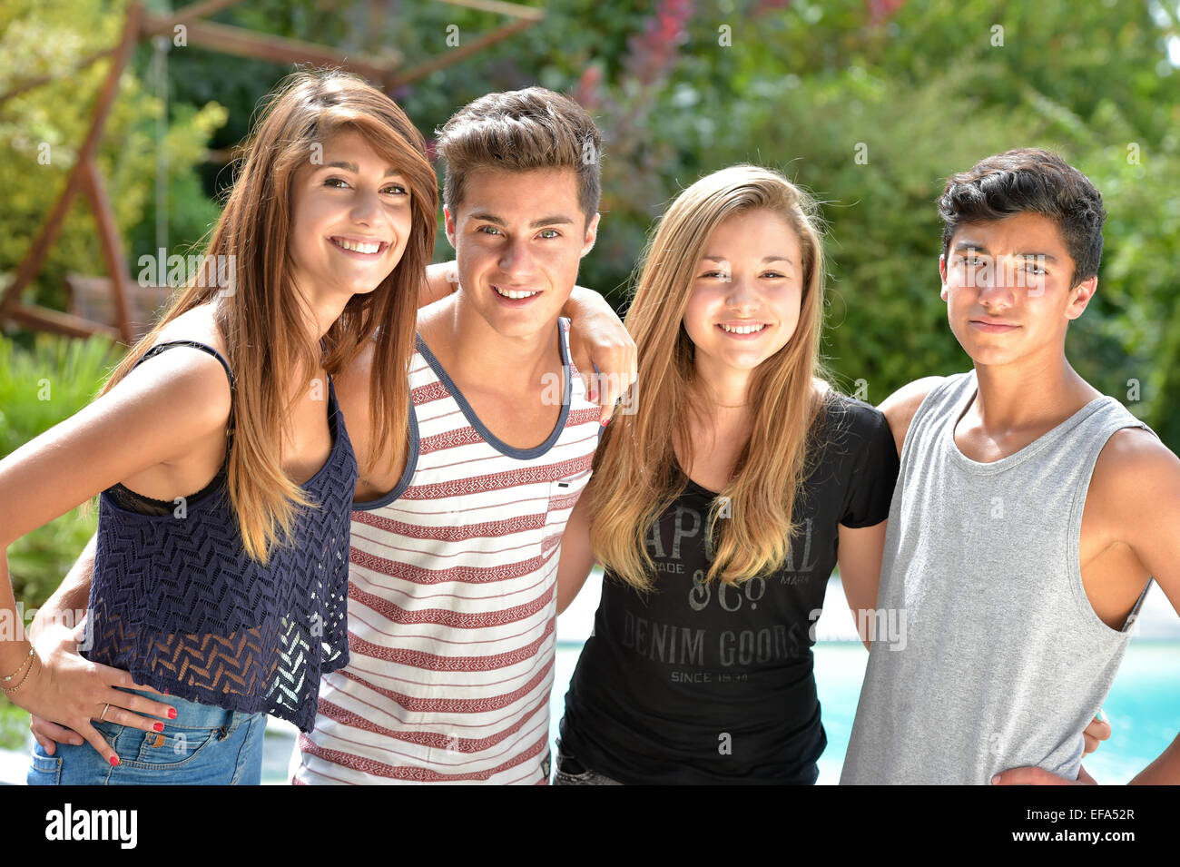 Group of girls laughing pointing hi-res stock photography and images ...