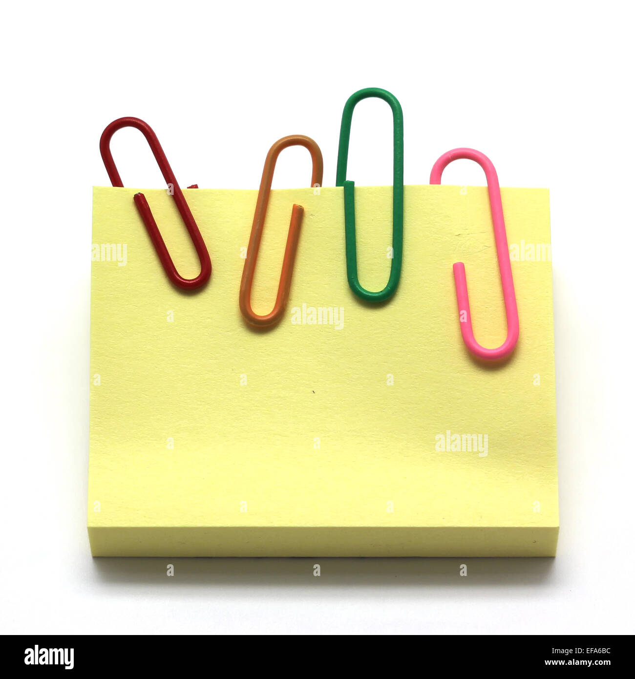 Paper clip and notepad isolated on white background Stock Photo - Alamy